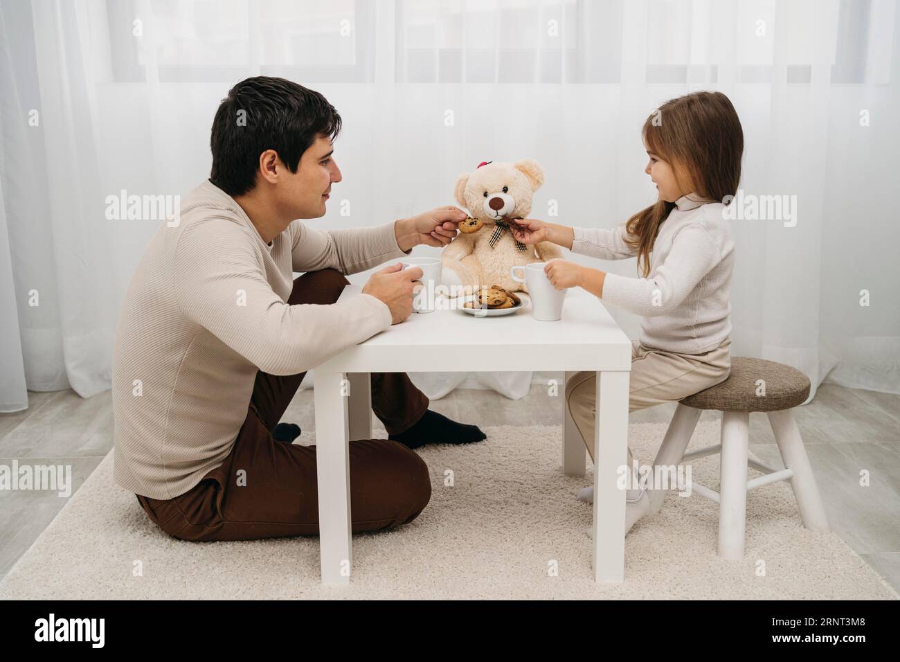 Father daughter home playing together Stock Photo - Alamy