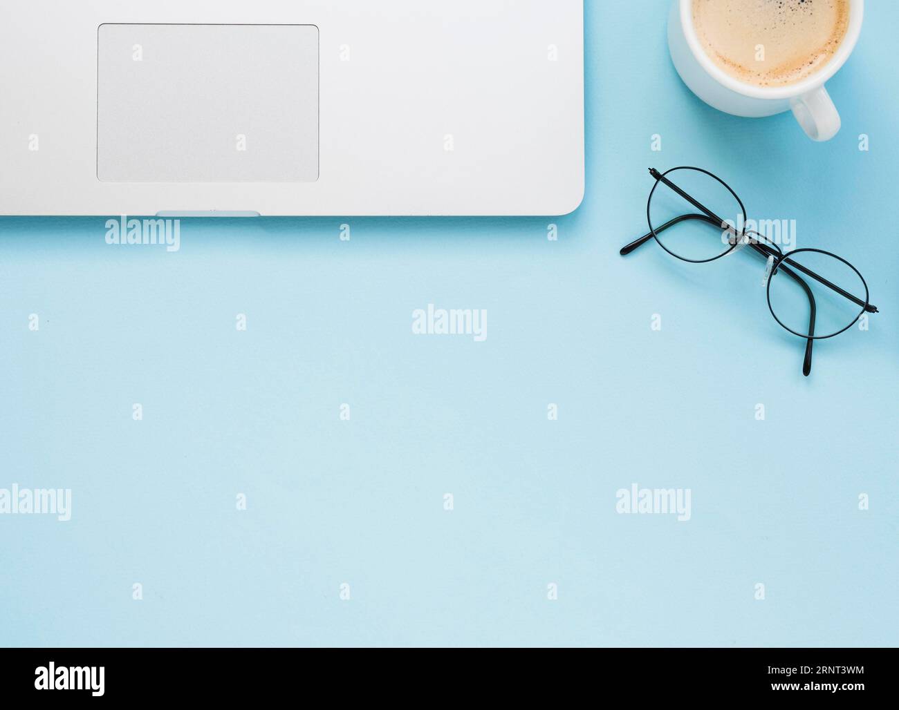 Flat lay clean office desk with blue background Stock Photo - Alamy