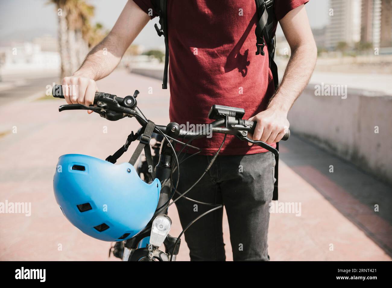 Front view man walking bicycle Stock Photo - Alamy