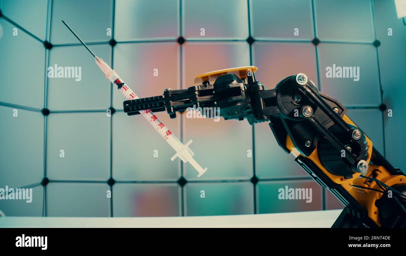 the robot holds a medical syringe concept the use of robotics in ...