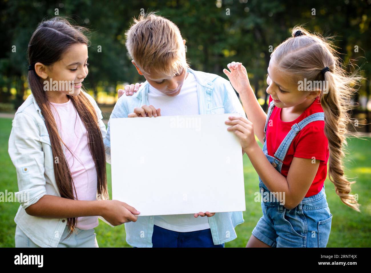 Children hold paper hi-res stock photography and images - Alamy