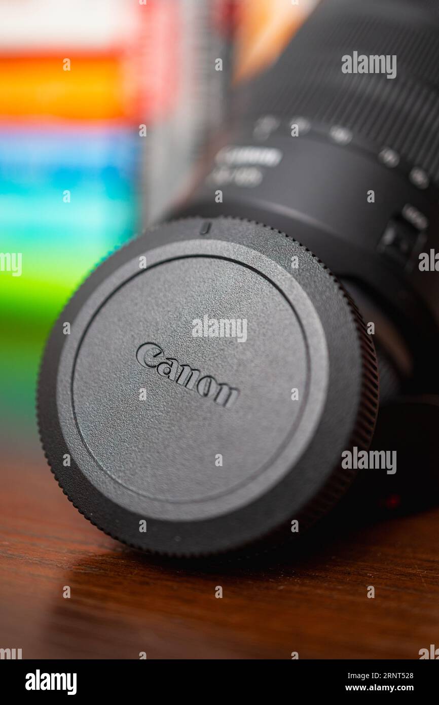 Wroclaw, Poland - May 17 2023: Camera lens cap of Canon RF lens next to ...