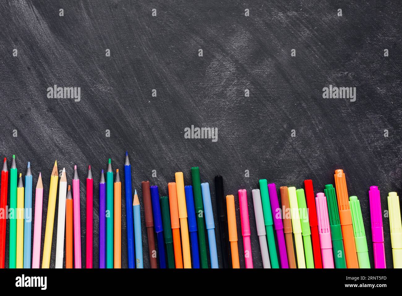 Bright felt pens pencils bottom dark background Stock Photo - Alamy