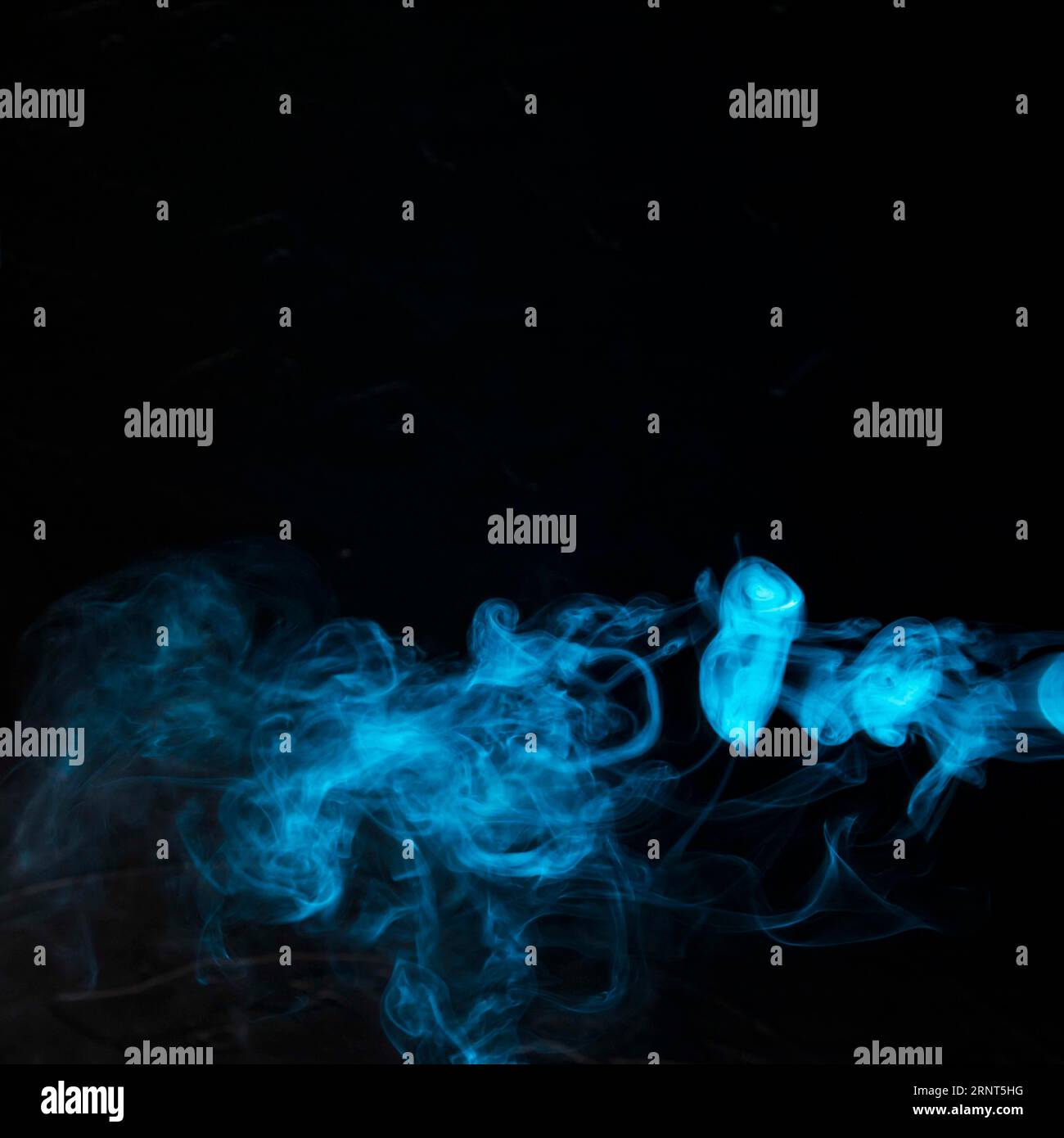 Blue smoke spread out wide dark background Stock Photo - Alamy