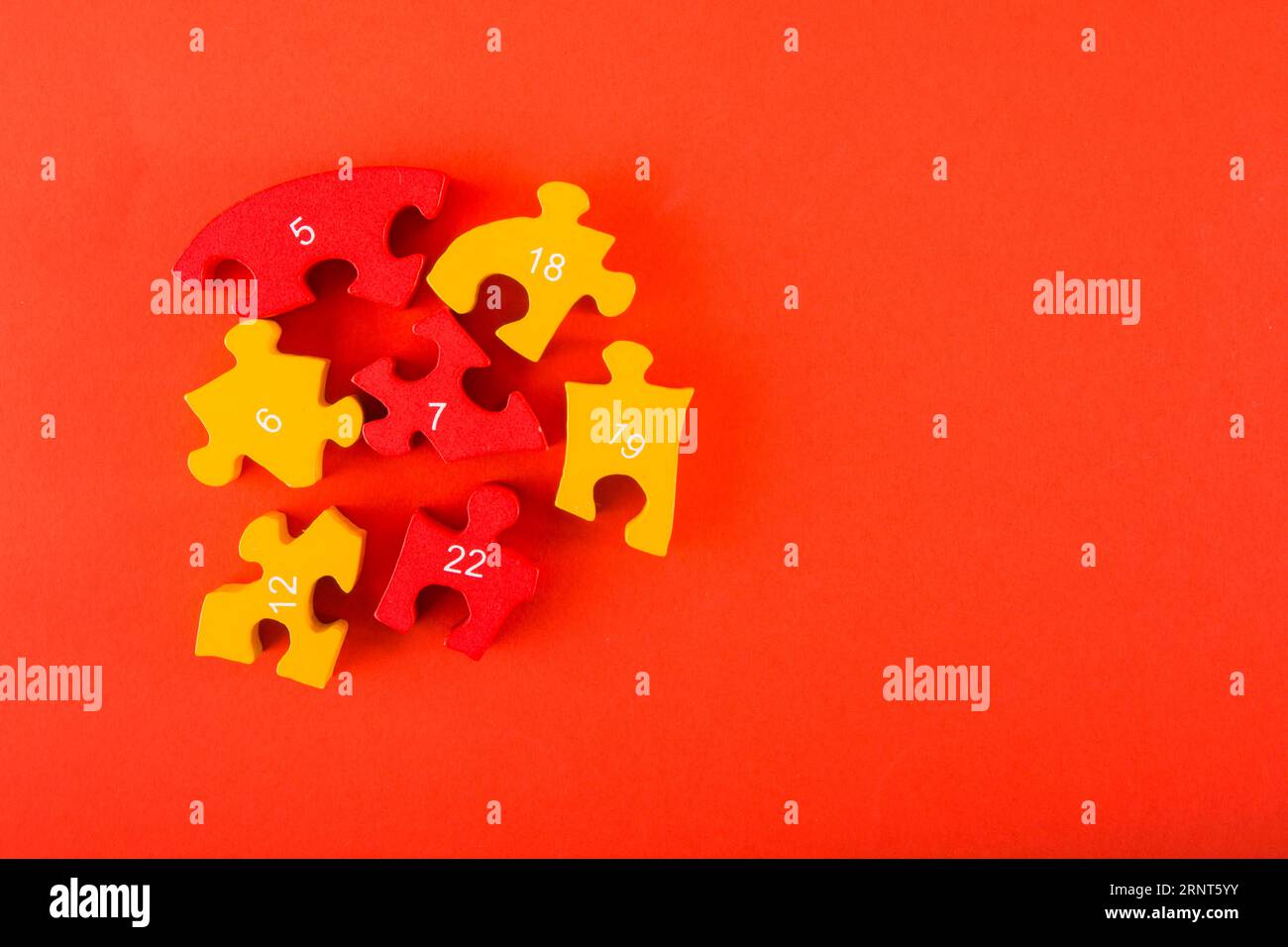 Puzzles with numbers red background Stock Photo - Alamy