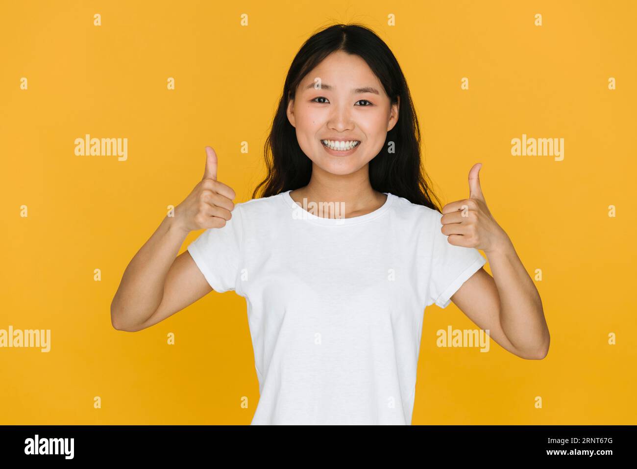 Smiley asian woman giving her approval Stock Photo - Alamy
