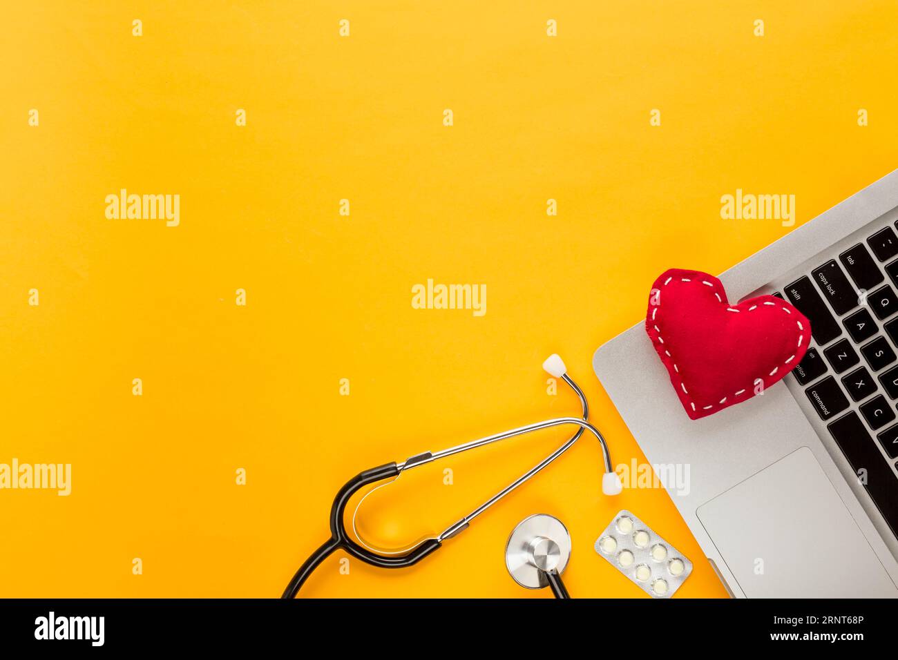 Stitched heart shape laptop with stethoscope blister packed tablet ...