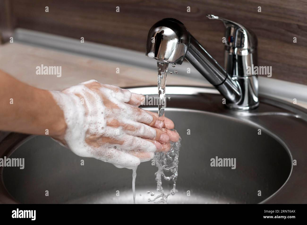 Side view woman washing hands sink Stock Photo - Alamy