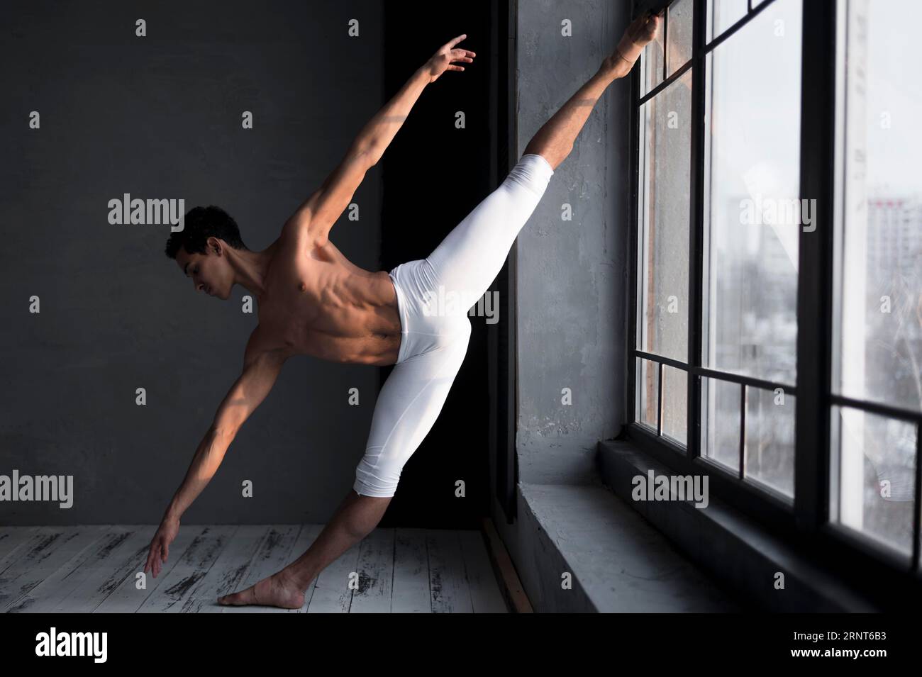 Side view male ballet dancer tights Stock Photo - Alamy
