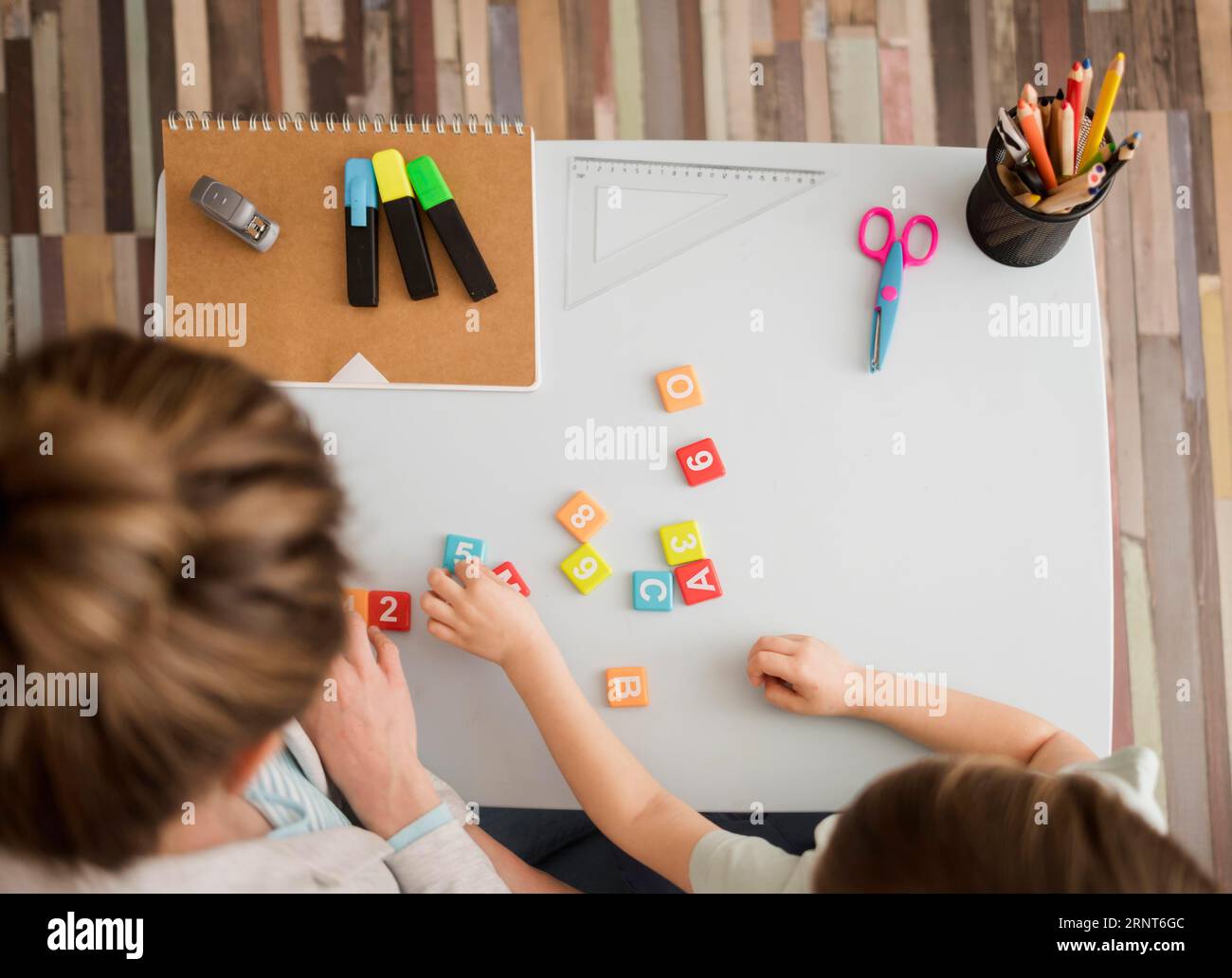 Top view child tutor learning about numbers letters Stock Photo - Alamy