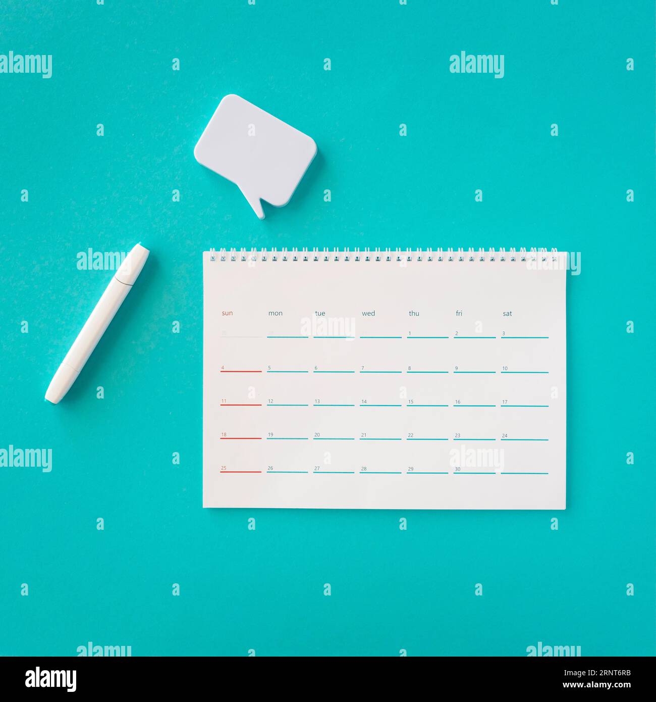 Top view planner calendar with chat bubble Stock Photo - Alamy