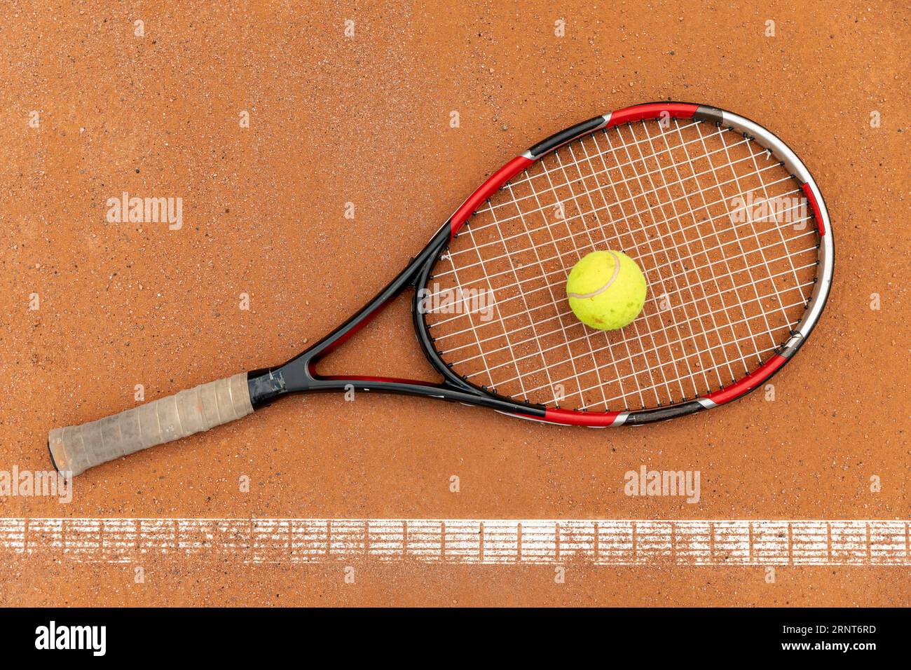 Top view tennis ball with racket ground Stock Photo - Alamy