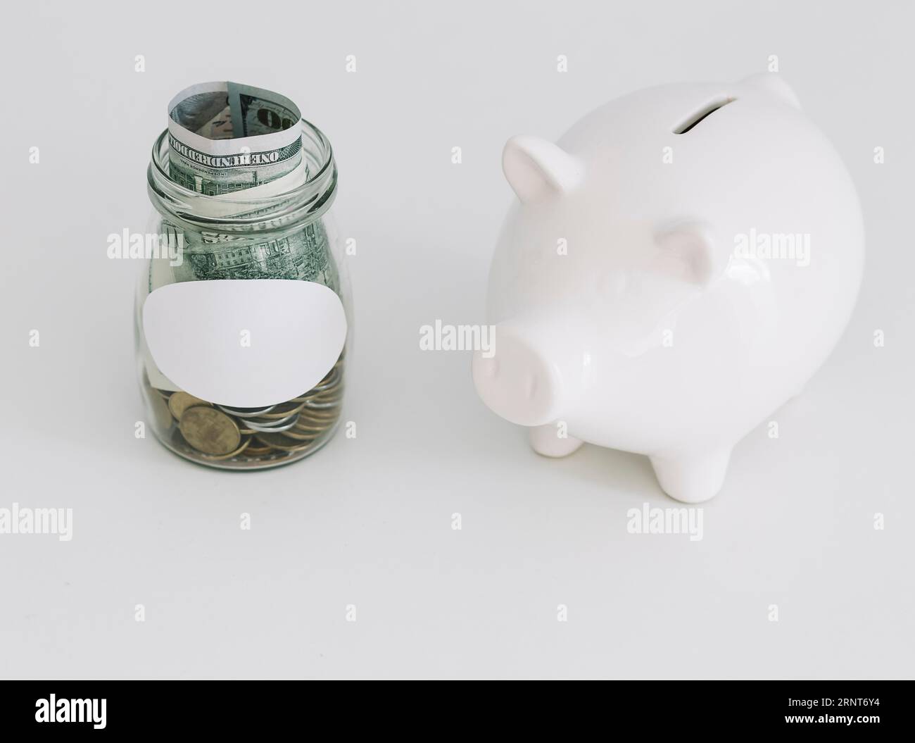 White piggybank open coin jar white background Stock Photo - Alamy