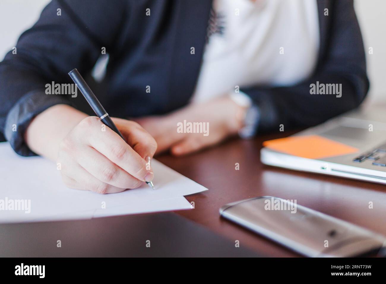 Woman boss office desk hi-res stock photography and images - Alamy