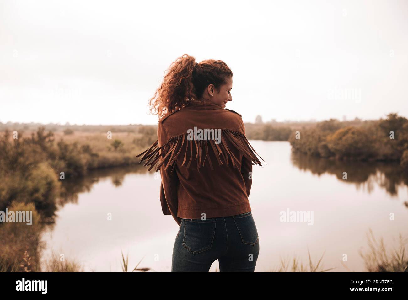 Back view woman posing pond Stock Photo - Alamy