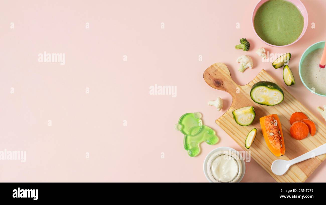 Baby food frame pink background Stock Photo - Alamy