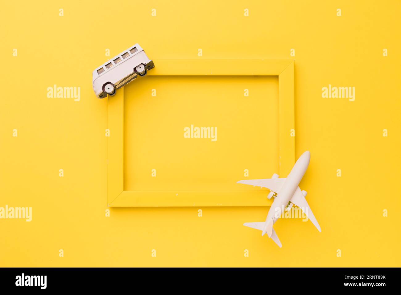 Composition toy airplane bus yellow frame Stock Photo - Alamy