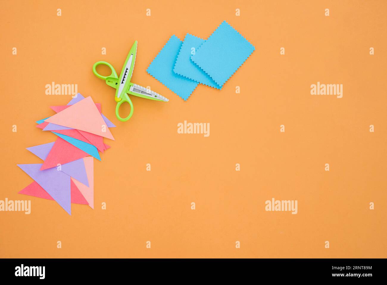 Colorful paper scissor colored backdrop Stock Photo - Alamy
