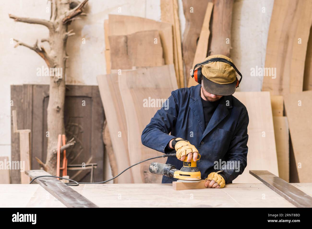 Carpenter using electric belt sander hi-res stock photography and ...