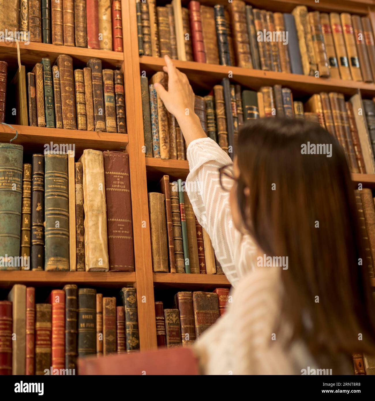 Old library book woman hi-res stock photography and images - Alamy