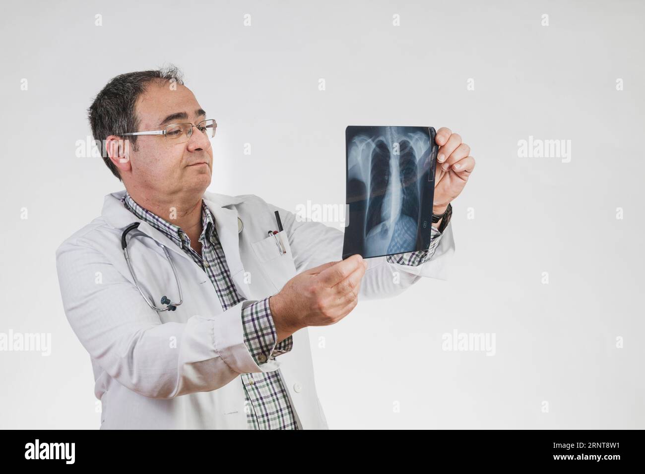 Doctor checking x ray scan Stock Photo - Alamy