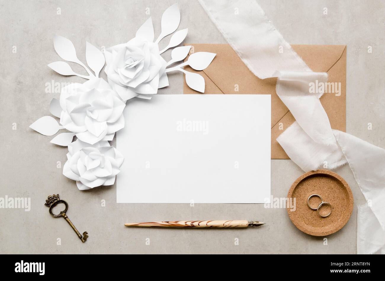 Elegant empty card with paper flowers Stock Photo - Alamy