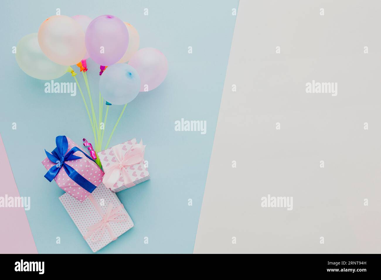 Flat lay frame with colorful balloons gifts Stock Photo - Alamy