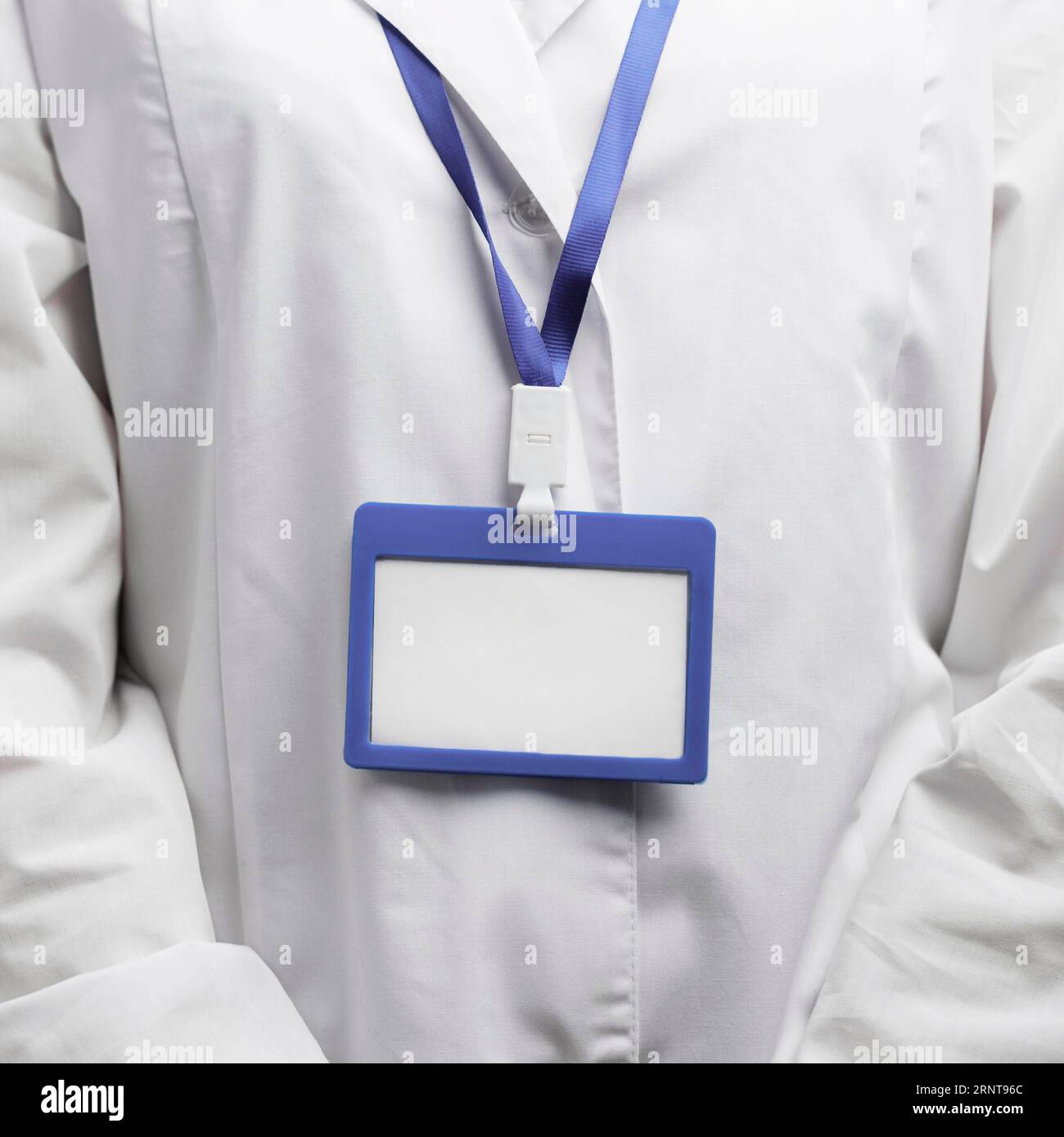 Front view female researcher with name badge Stock Photo - Alamy