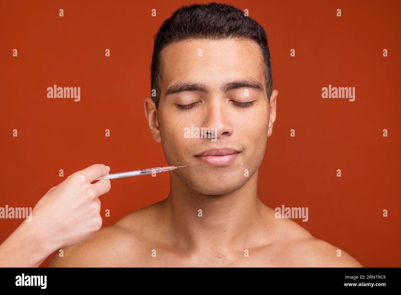 Front view young male syringe Stock Photo - Alamy