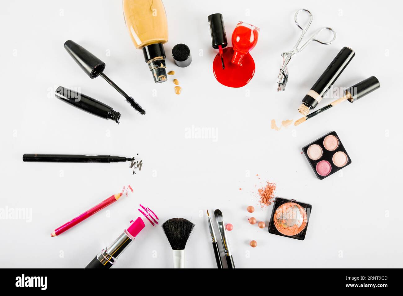 Various makeup products forming circular frame white background Stock ...