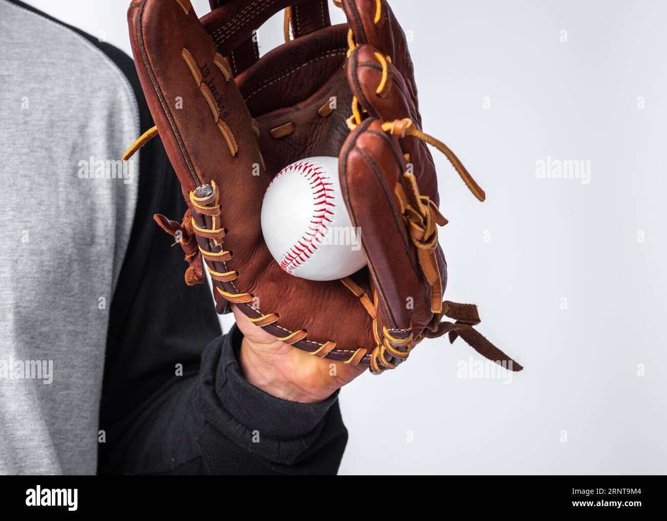 Hand holding softball hi-res stock photography and images - Alamy