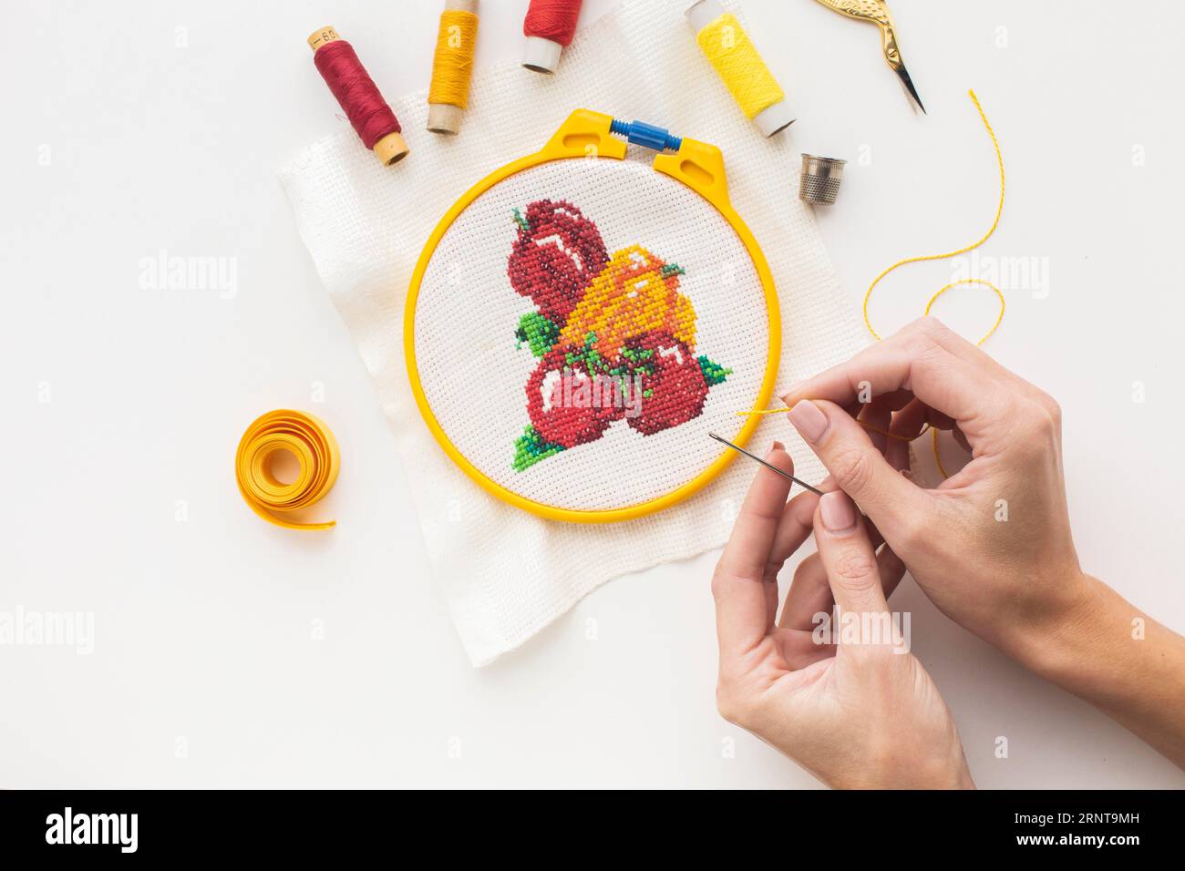 Hands creating design with needle sewing thread Stock Photo - Alamy