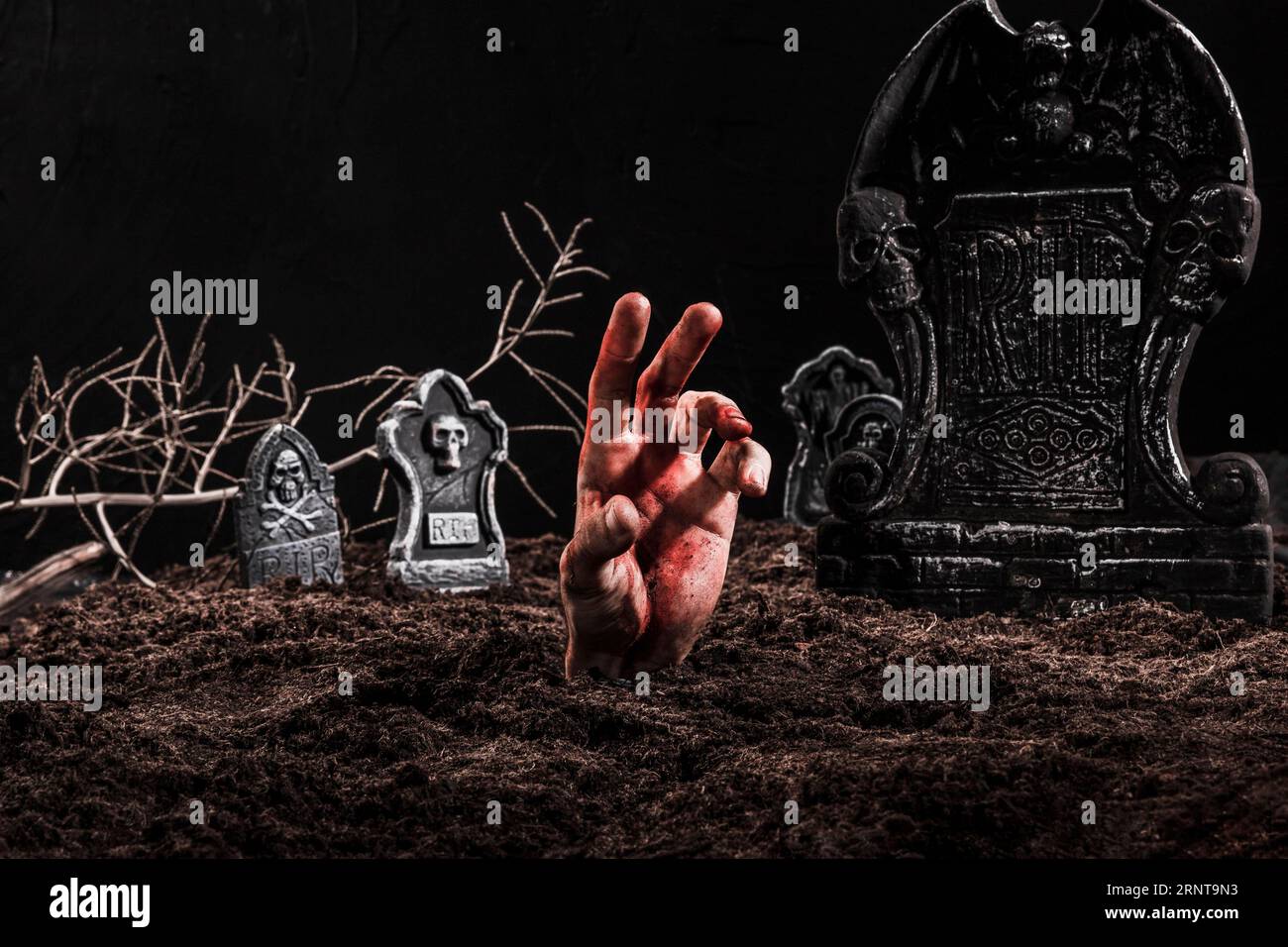 Hand sticking out grave dark cemetery Stock Photo - Alamy