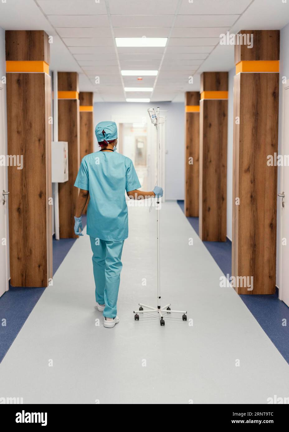 Nurse walking hall hi-res stock photography and images - Alamy