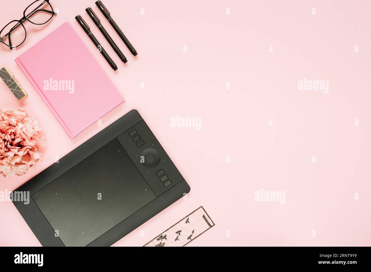 Graphic digital tablet stationeries pink background Stock Photo - Alamy
