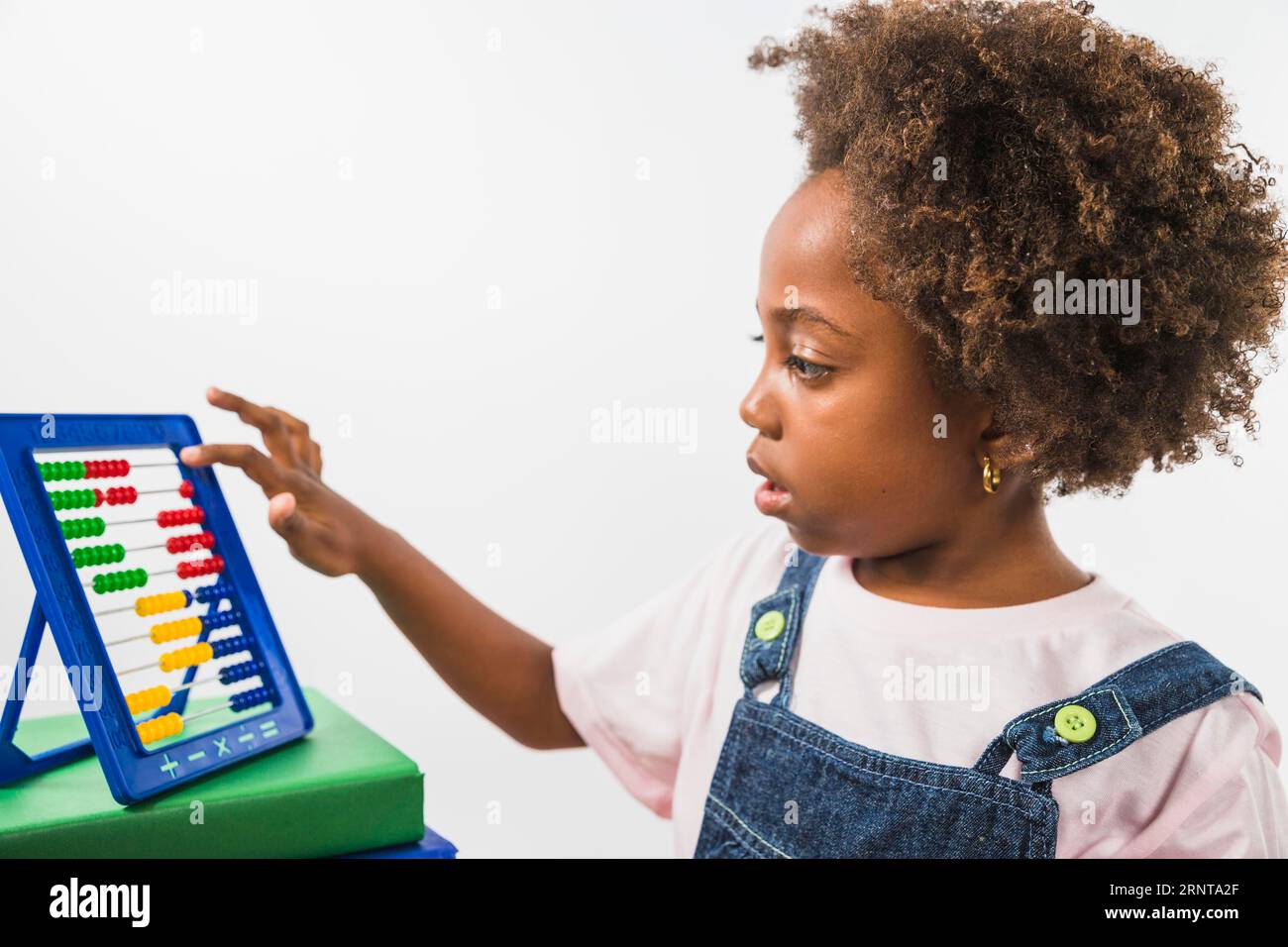 Kid playing with abacus studio Stock Photo - Alamy