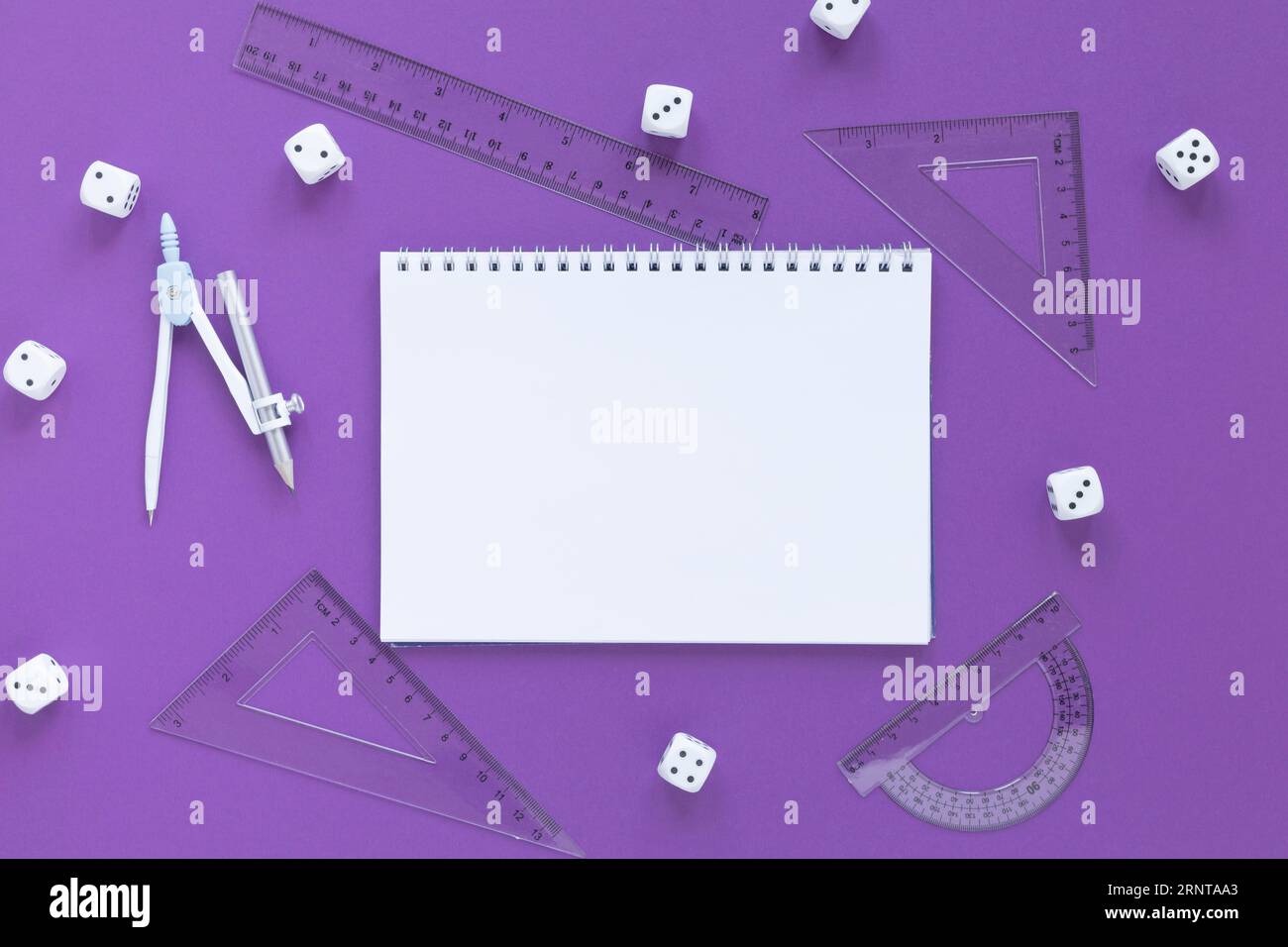 Math rulers supplies with dices empty notebook Stock Photo - Alamy