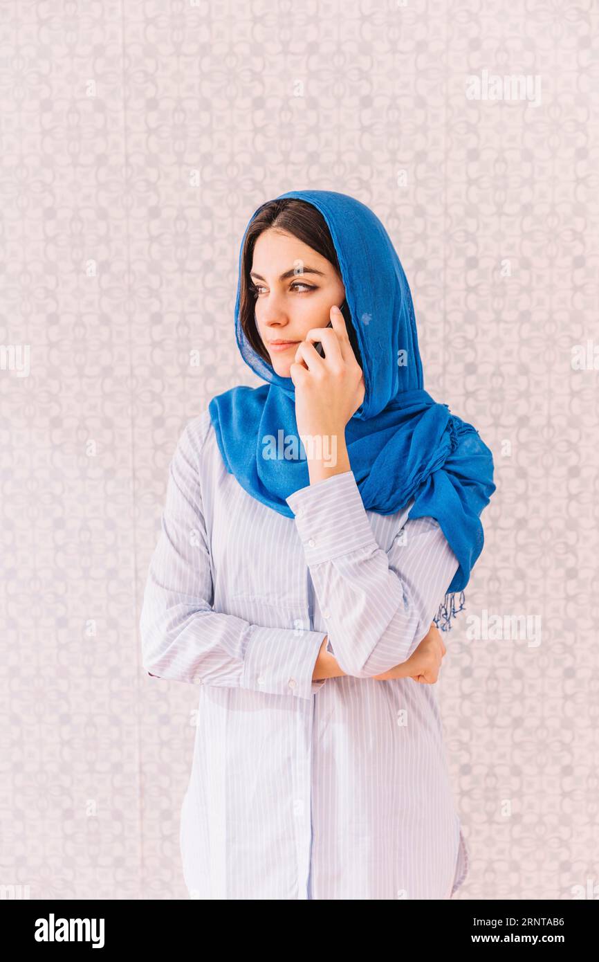 Muslim woman making phone call Stock Photo - Alamy