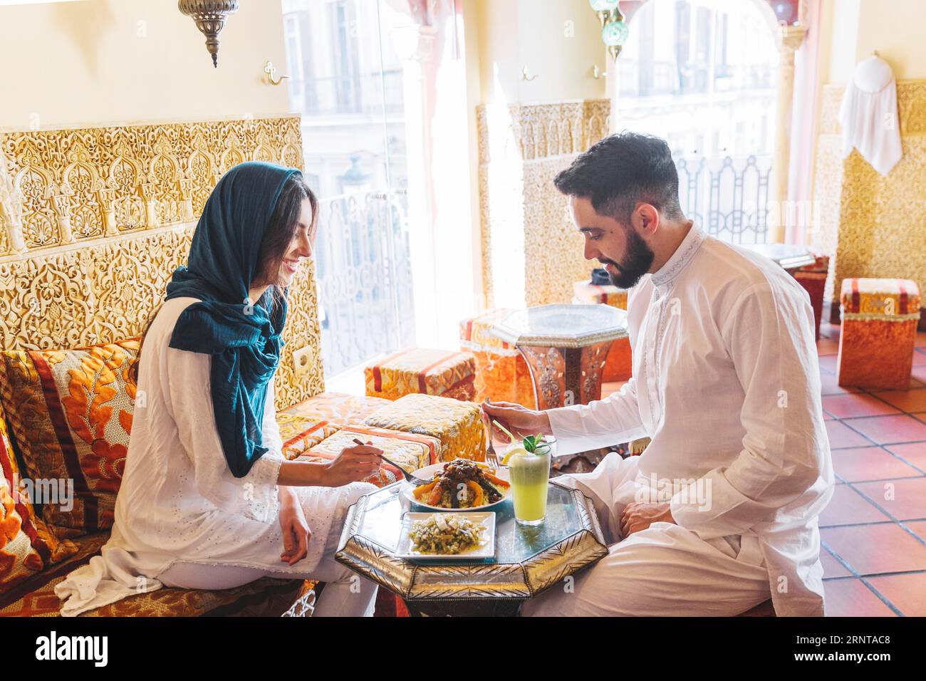 Modern muslim couple arab restaurant Stock Photo - Alamy