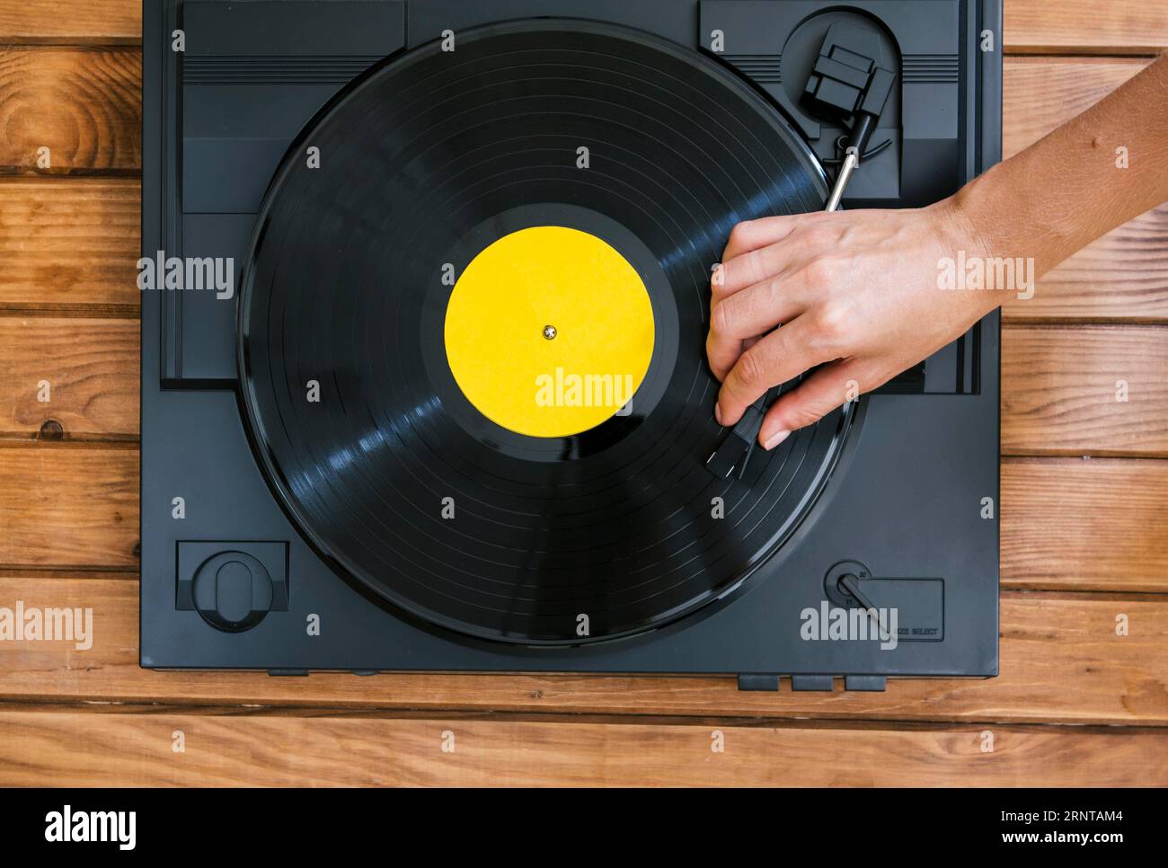 Person playing vinyl disk vintage music player Stock Photo - Alamy