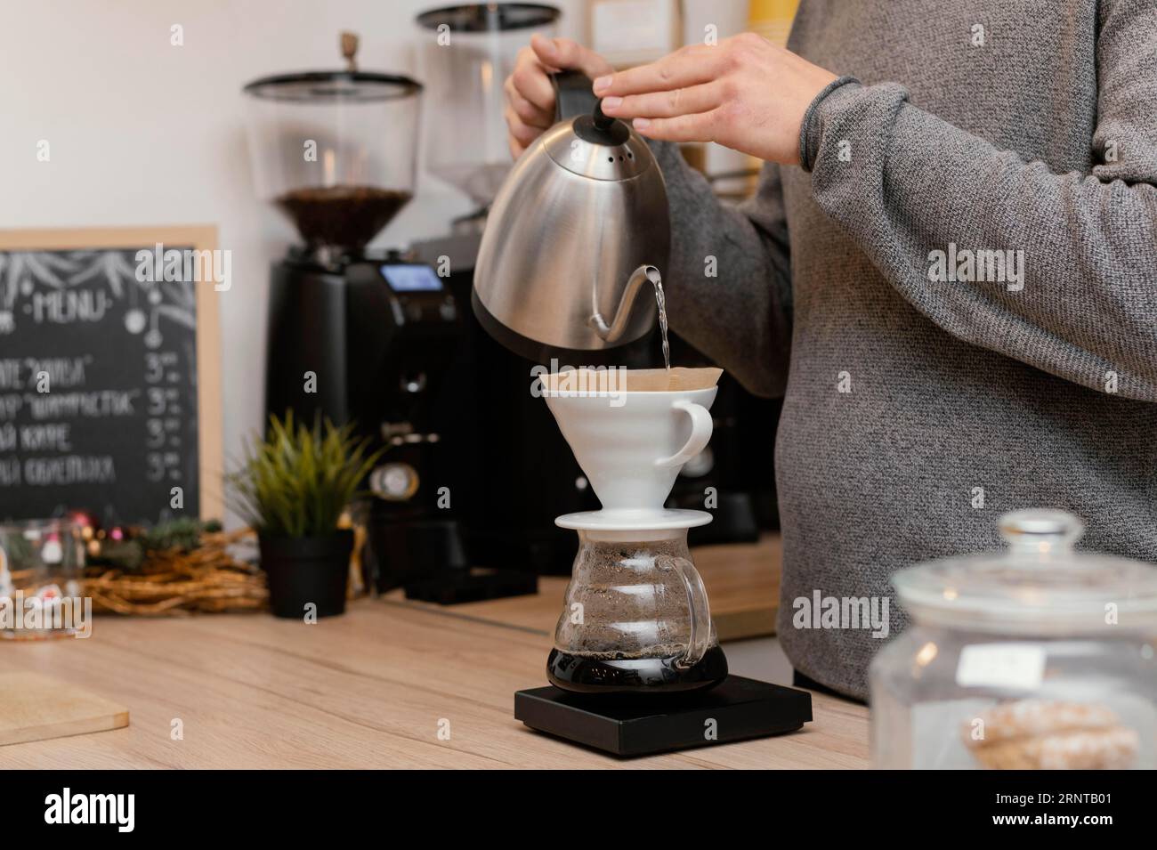 Side view male barista hi-res stock photography and images - Alamy