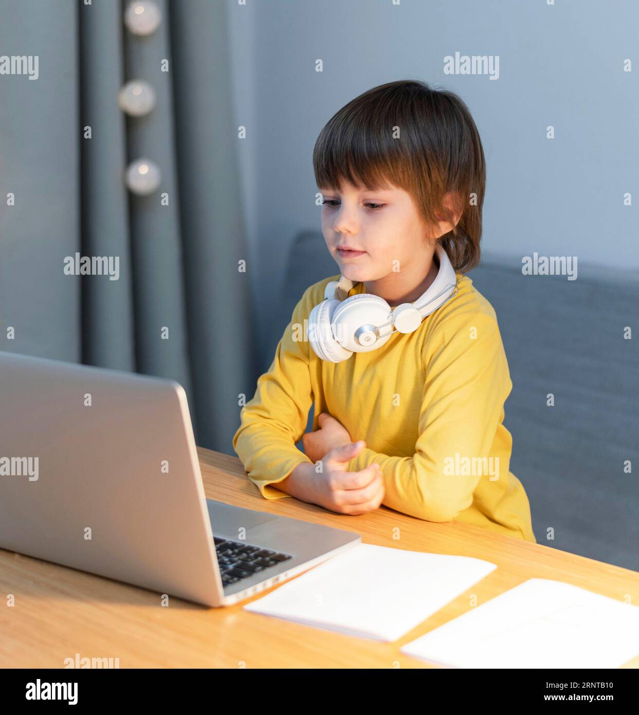 Side view child online school interactions Stock Photo - Alamy