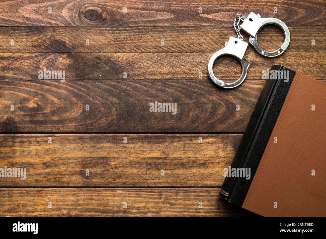Top view frame with book handcuffs Stock Photo - Alamy