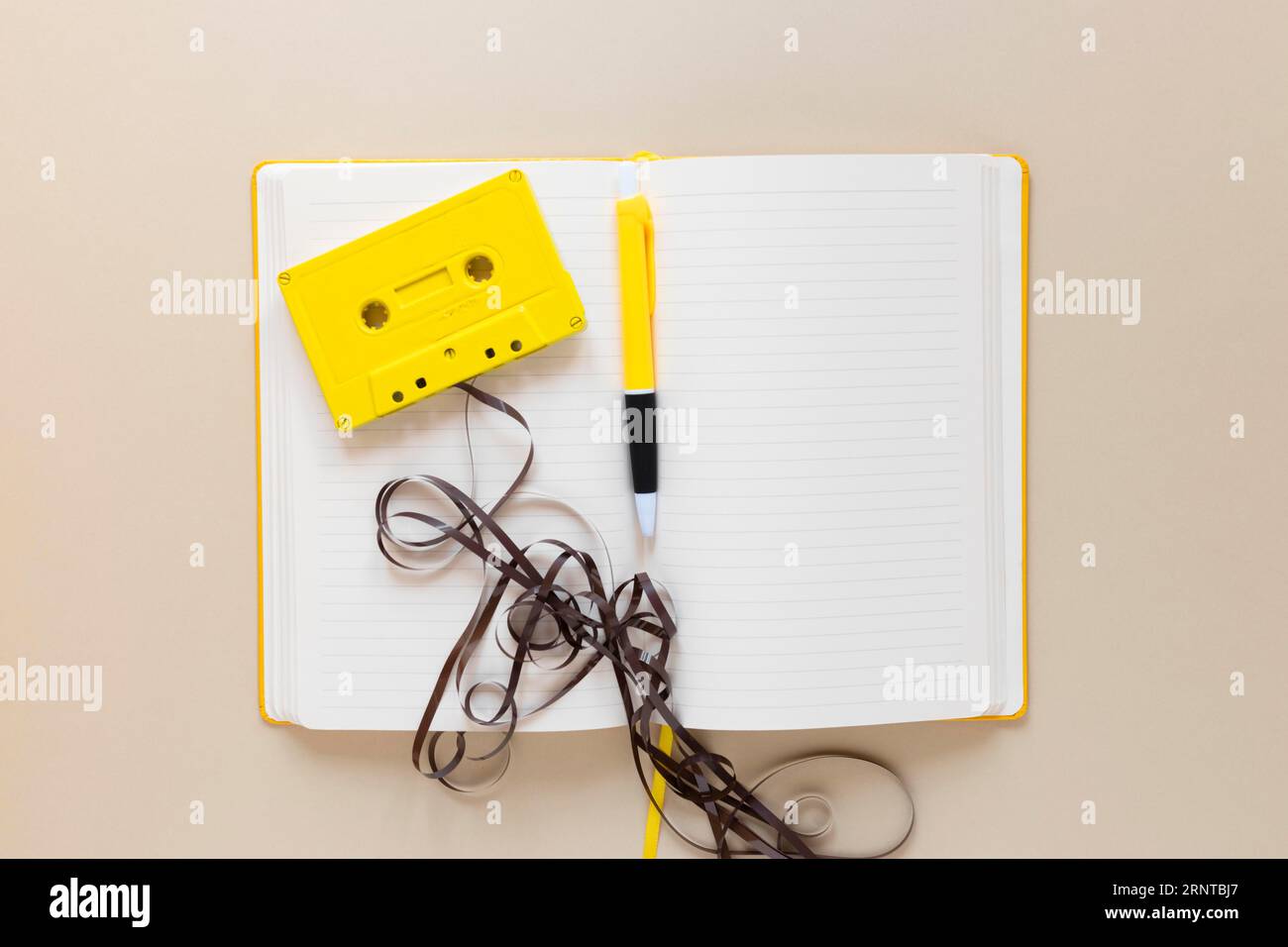 Top view notebook with cassette Stock Photo - Alamy
