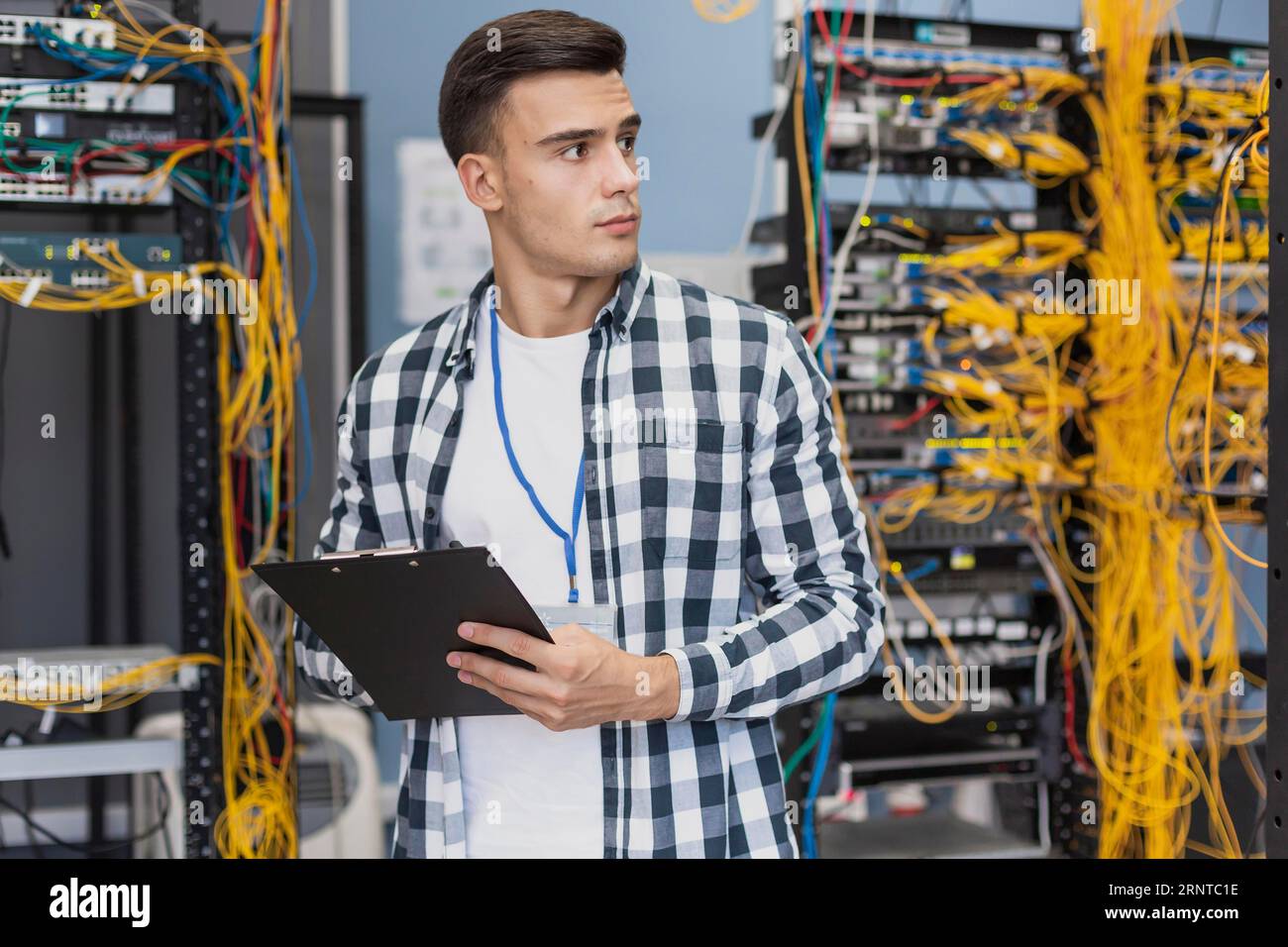 Young engineer server room Stock Photo - Alamy