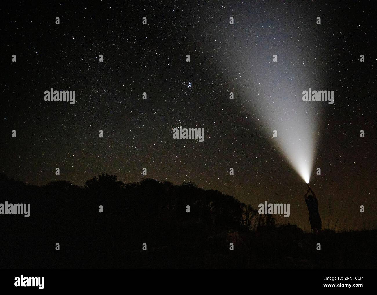 Beam light starry night sky Stock Photo - Alamy