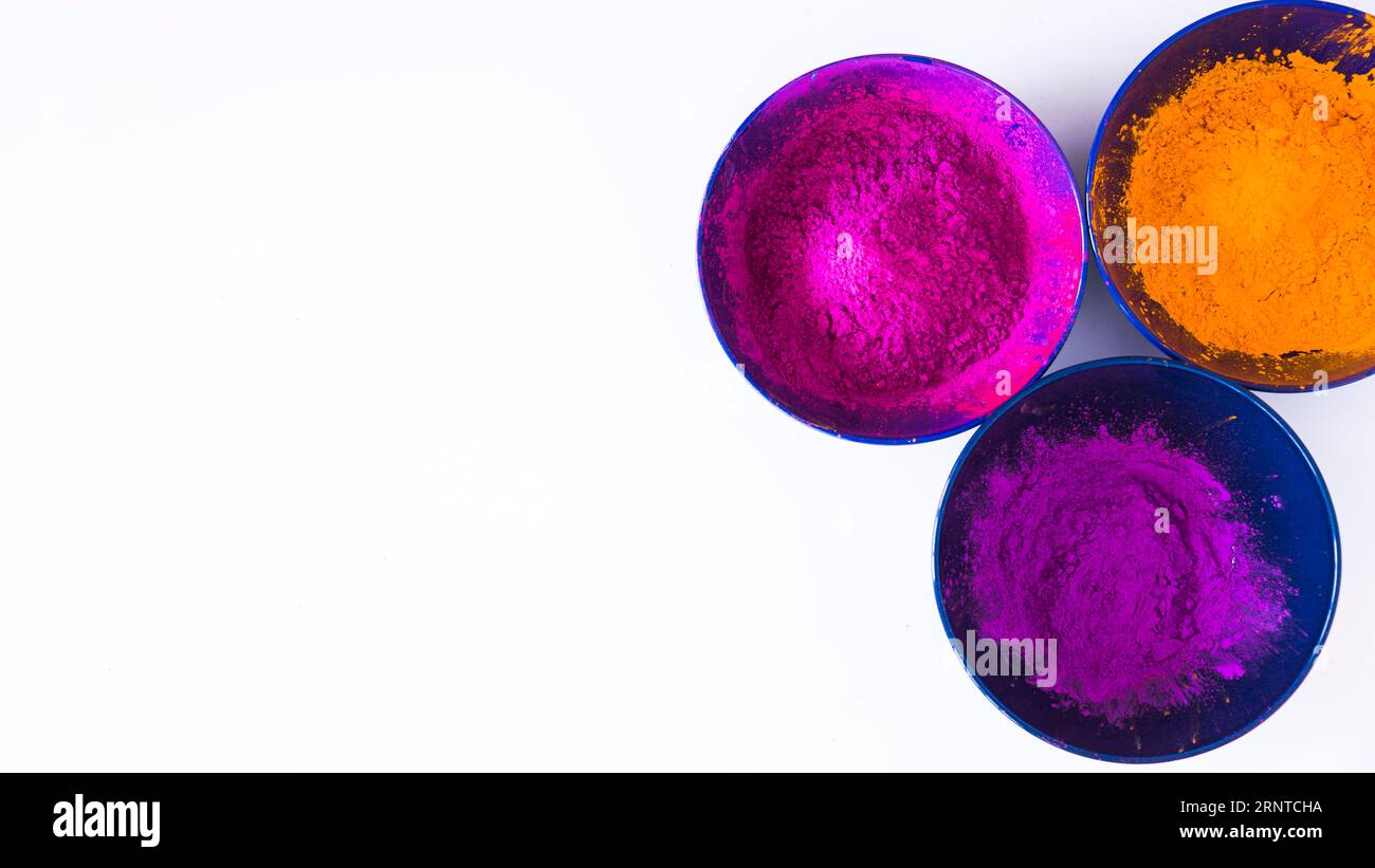 Bowls holi color powder white background Stock Photo - Alamy