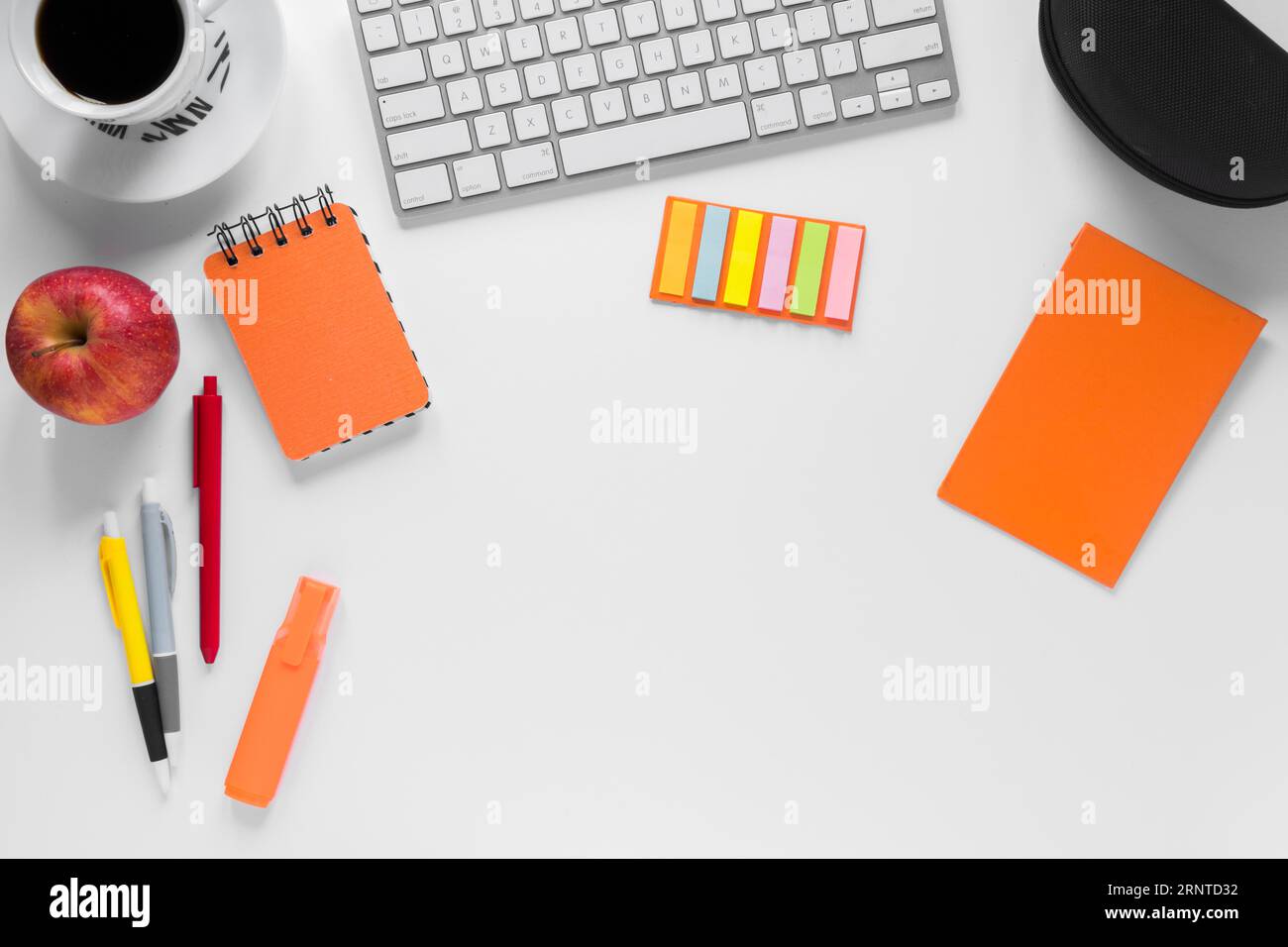 Colorful stationeries with coffee cup apple keyboard white desk Stock ...