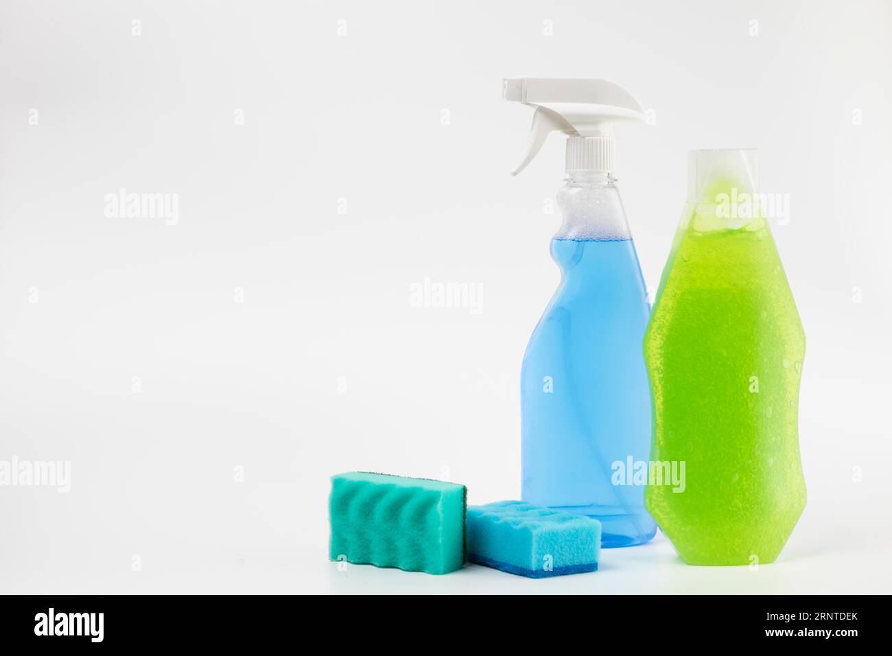 Different cleaning items with white background Stock Photo - Alamy