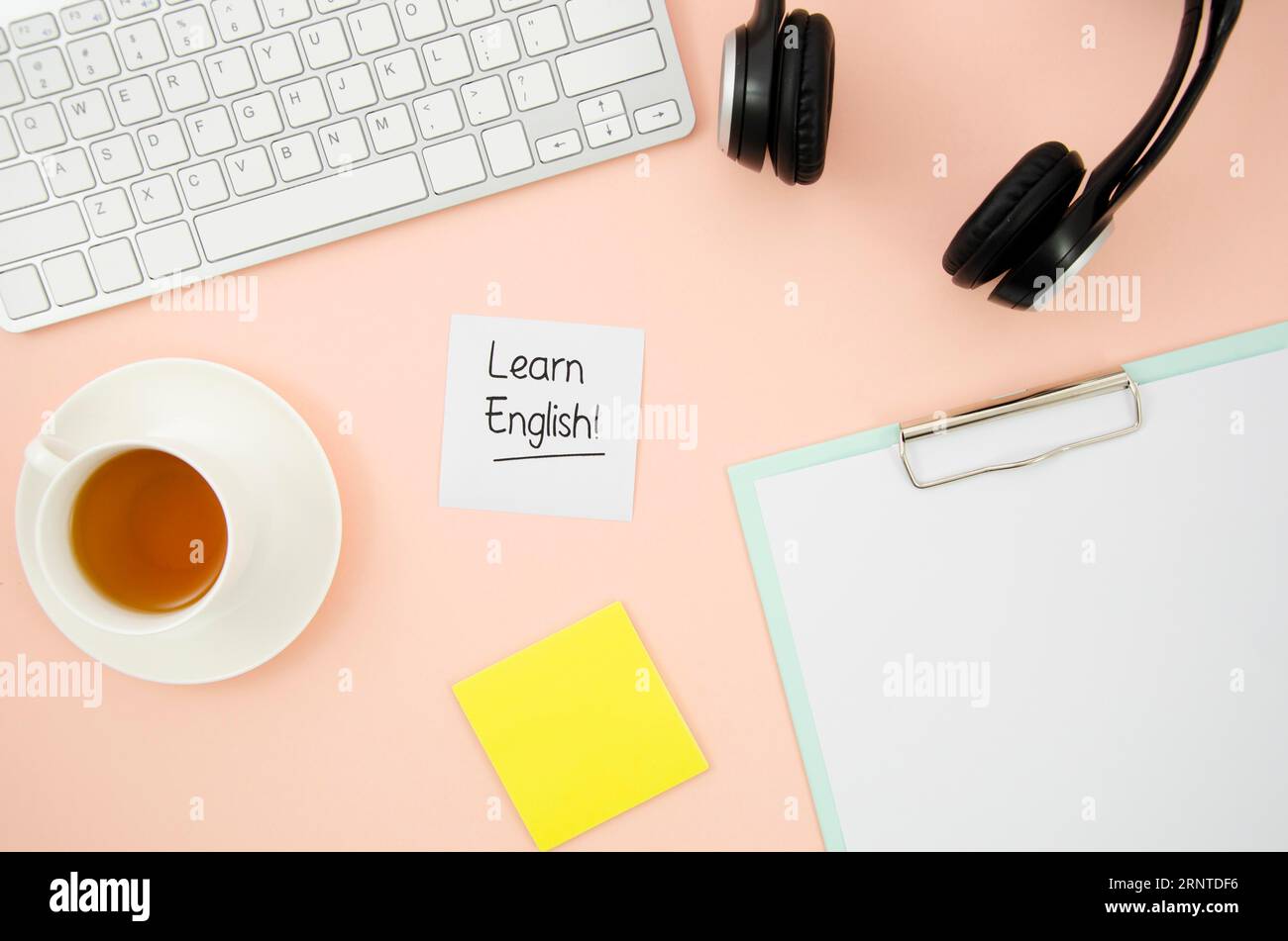 Different learning objects peach background Stock Photo - Alamy